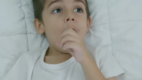 Caucasian boy child in the bed feeling u... | Stock Video | Pond5