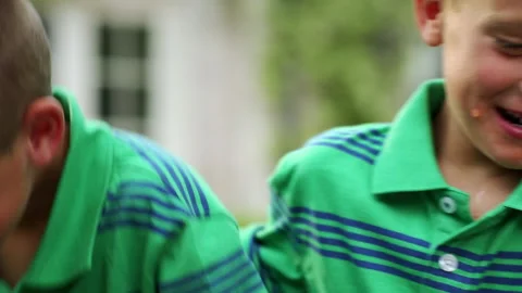 Caucasian boy giving twin brother noogie... | Stock Video | Pond5