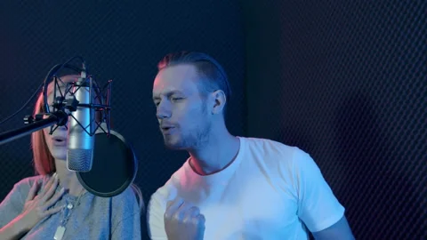 Caucasian male singer sings in dual with... | Stock Video | Pond5