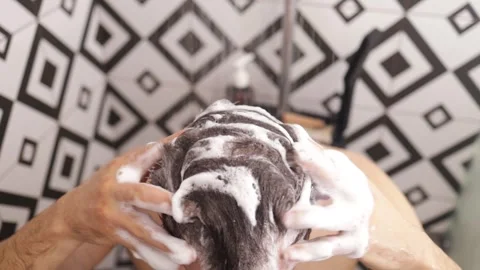 Caucasian man taking a shower washing ha... | Stock Video | Pond5