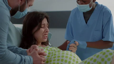 Caucasian woman giving birth to child in... | Stock Video | Pond5