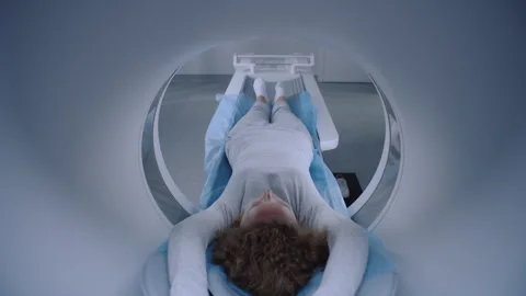 Caucasian woman undergoes MRI or CT scan... | Stock Video | Pond5