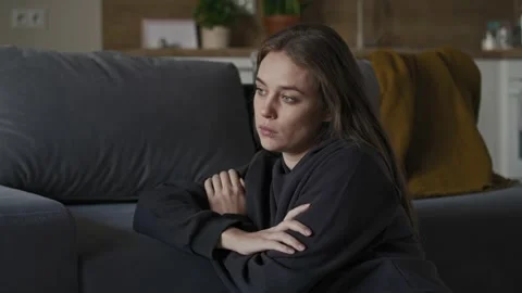 Caucasian young woman sitting at the flo... | Stock Video | Pond5