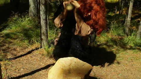 caveman smashing rocks rock tool making ... | Stock Video | Pond5