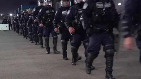 CBP officer walking with riot shields at... | Stock Video | Pond5