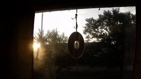 CD hanging in a window as a ornament on ... | Stock Video | Pond5