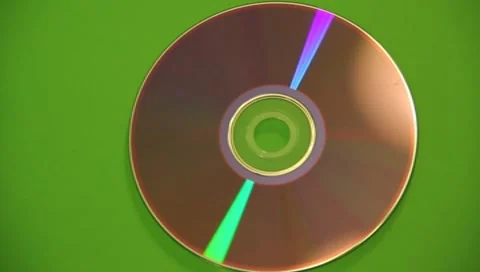 CD's and DVD's random pile up on green s... | Stock Video | Pond5