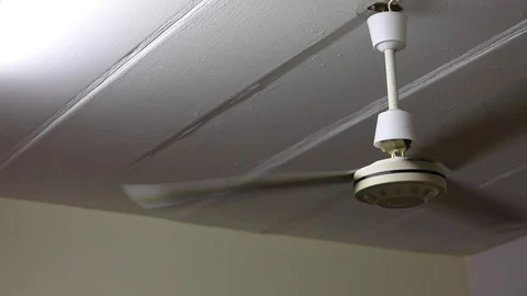 A Ceiling Fan Rotating Inside The House ... | Stock Video | Pond5