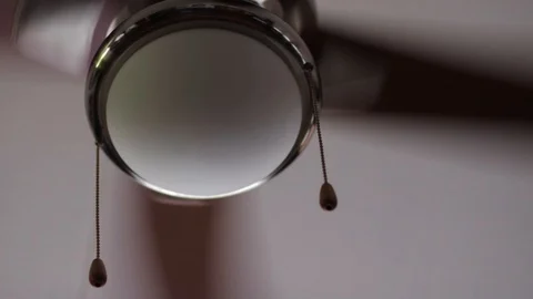 A ceiling fan spinning fast. | Stock Video | Pond5