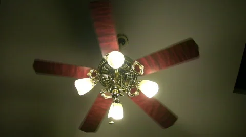 Ceiling fan Spinning with a four light b... | Stock Video | Pond5
