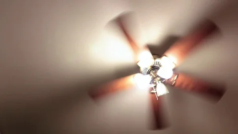 A ceiling fan spinning on high with the ... | Stock Video | Pond5