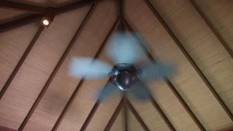 The ceiling fan is spinning. The interio... | Stock Video | Pond5