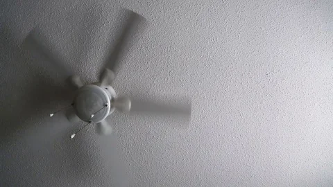 Ceiling fan spinning from low angle | Stock Video | Pond5