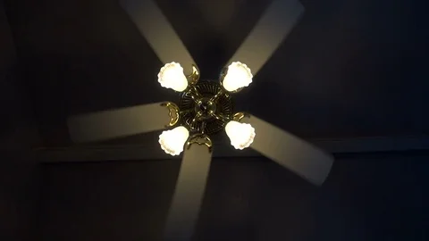 Ceiling fan turns against dark backgroun... | Stock Video | Pond5