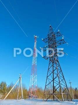 Cell antenna, transmitter. Telecom TV radio mobile tower against blue ...