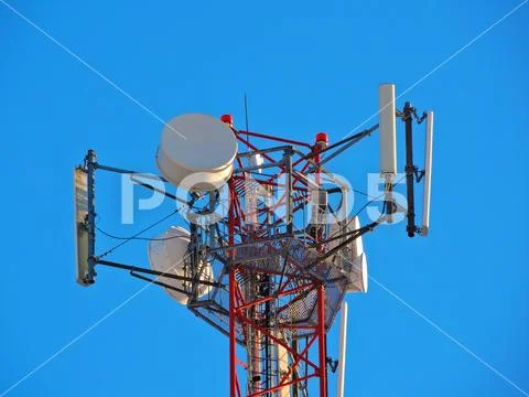 Cell antenna, transmitter. Telecom TV radio mobile tower against blue sky Stock Image #77887796