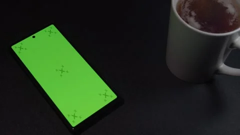 Cell Phone green screen, cup of tea | Stock Video | Pond5