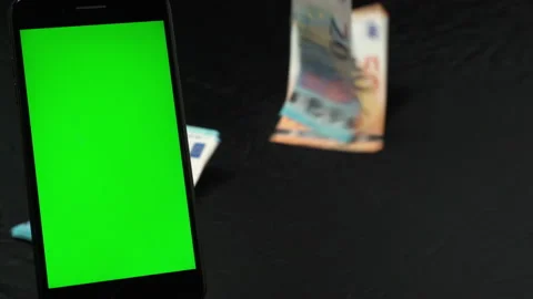 Cell phone with vertical green screen on... | Stock Video | Pond5