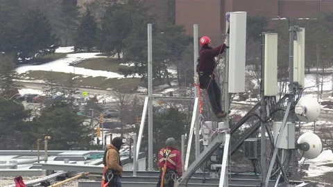 Cell tower network workers installing an... | Stock Video | Pond5