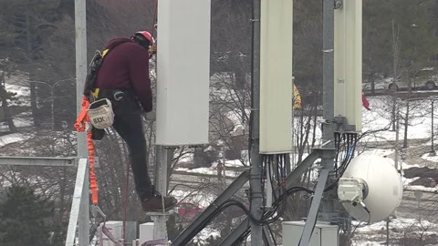 Cell tower network workers installing an... | Stock Video | Pond5