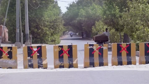 Cement stone roadblocks used to close th... | Stock Video | Pond5