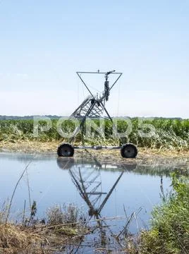 Center pivot irrigation in corn field Stock Photo #122081770