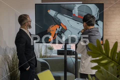 CEO of company studio developers of games discusses with the artist 3D ...