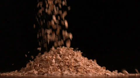 Cereal flakes pouring on black backgroun... | Stock Video | Pond5