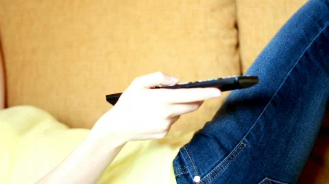 Changing channels on tv with remote cont... | Stock Video | Pond5