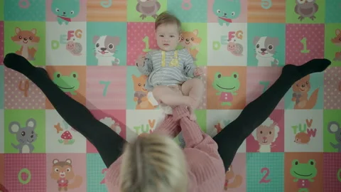 Changing diapers - Top view of a mother ... | Stock Video | Pond5