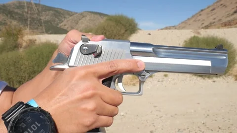 Changing the manual safety to fire mode ... | Stock Video | Pond5