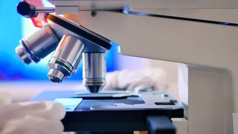 Changing a piece of glass under a micros... | Stock Video | Pond5