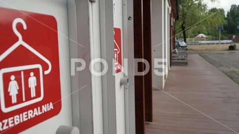 Photograph: Changing Room Building with Doors Labeled "Przebieralnia ...