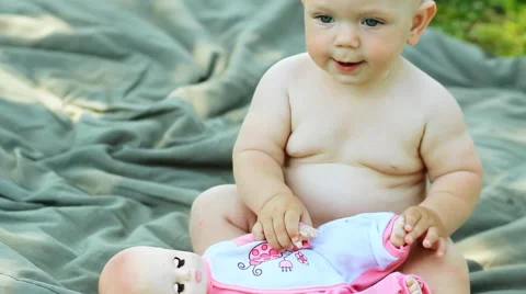 Charming baby boy playing in the garden ... | Stock Video | Pond5