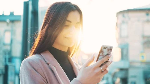 Charming face young woman uses phone sta... | Stock Video | Pond5