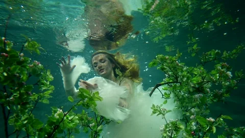 charming lady is floating fabulous garde... | Stock Video | Pond5