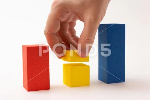 Chart from color blocks. Hand creates chart column. Stock Photo #147988070