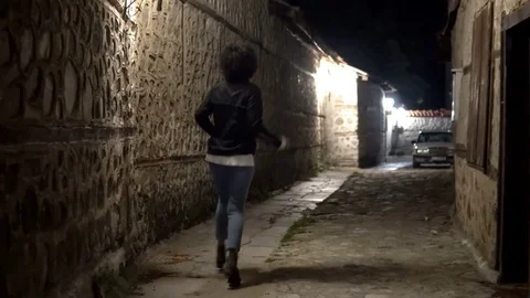 Chasing a Woman Running Away in Old stre... | Stock Video | Pond5