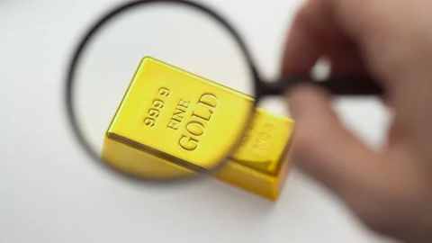 Checking gold bars with a magnifying gla... | Stock Video | Pond5