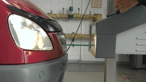 Checking the headlights of a car at a ve... | Stock Video | Pond5
