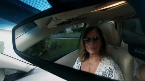 Checking the rear view mirror | Stock Video | Pond5