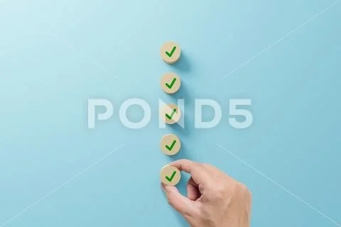 Photograph: Checklist and check mark concept. Check mark on wooden ...