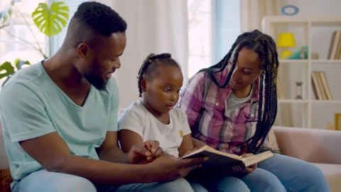 Cheerful african parents and little girl... | Stock Video | Pond5