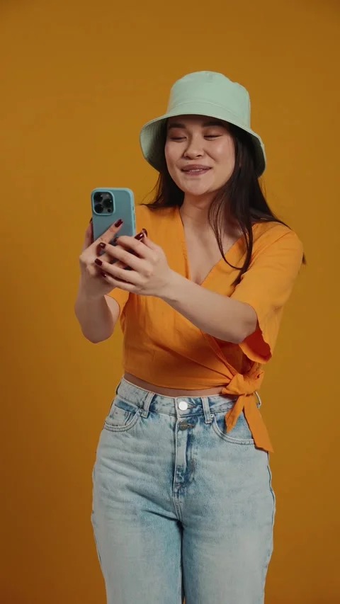 Cheerful Asian woman speaking by video c... | Stock Video | Pond5