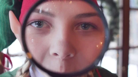 Cheerful elf girl looking at the camera ... | Stock Video | Pond5