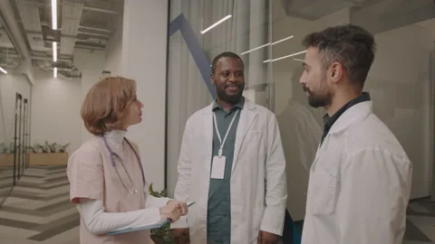Cheerful Medical Team Talking in Hospita... | Stock Video | Pond5