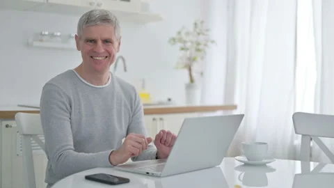 Cheerful Senior Old Man with Laptop Smil... | Stock Video | Pond5