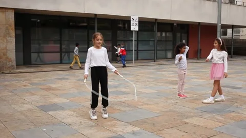 Cheerful sporty tween girl jumping rope ... | Stock Video | Pond5