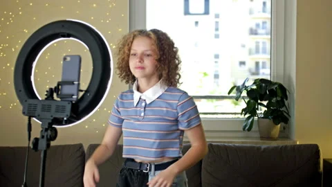 Cheerful teen girl dancing at camera fil... | Stock Video | Pond5