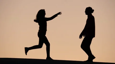 Cheerful young woman run and hug man, he... | Stock Video | Pond5